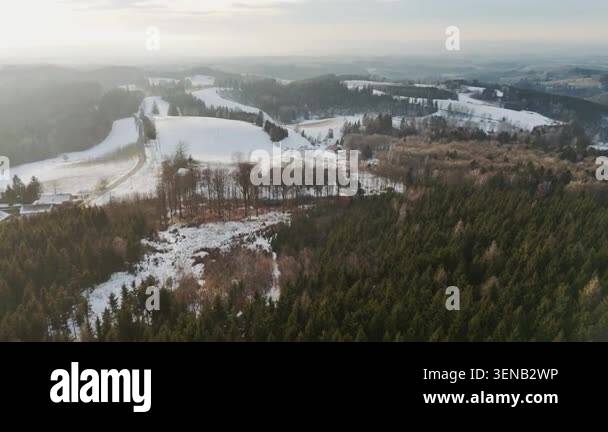 An aerial drone shot overlooking a vast winter landscape featuring snow ...