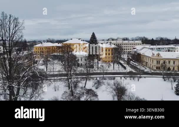An aerial view shows yellow and white historic buildings surrounded by ...
