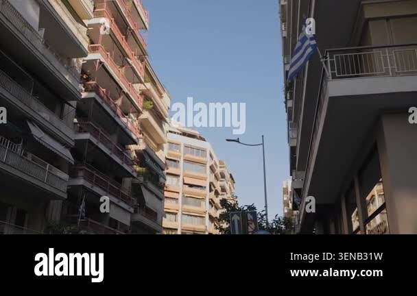A low angle shot looking up at multi-story residential apartment ...