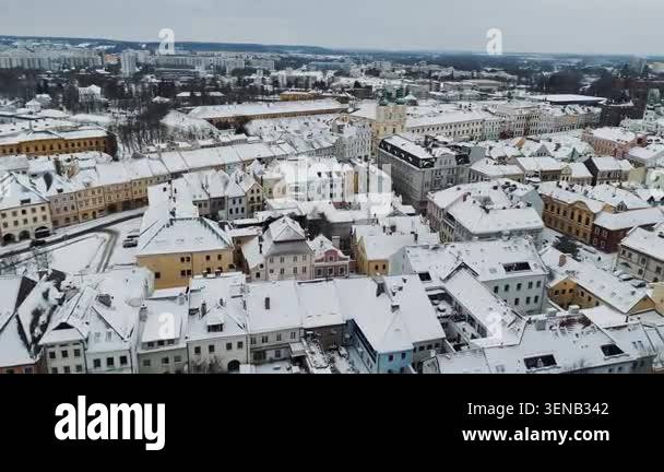 An aerial drone view overlooking the rooftops and streets of a historic ...