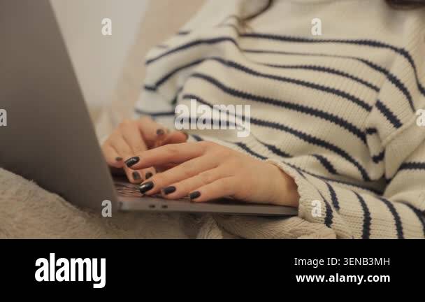 Close-up view of a womans hands typing on a laptop keyboard. Relaxing ...