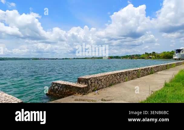A scenic perspective of the concrete malecon path at the Pedregal beach ...