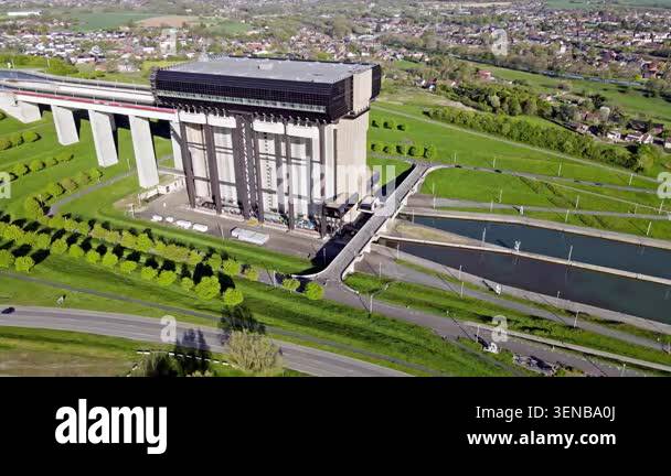 Static aerial drone view of canal lift transport hub surrounded by lush ...