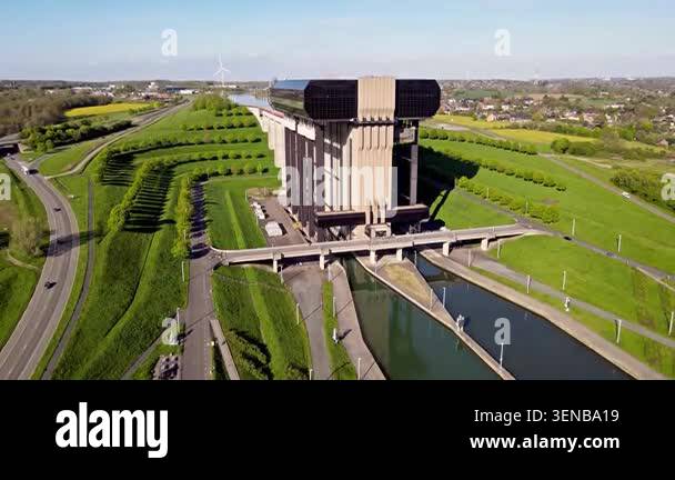 Vertical orbital drone movement around canal lift tower showing ...
