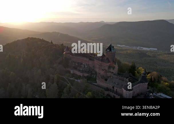 Aerial view of medieval castle fortress illuminated by last golden ...