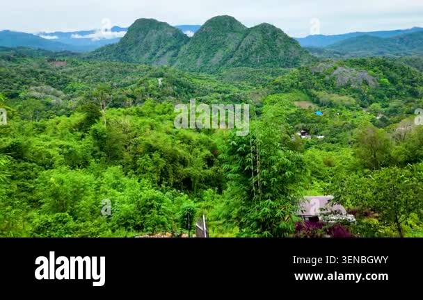 Aerial View of Winding Road Through Tropical Forest Below Twin Peaks ...