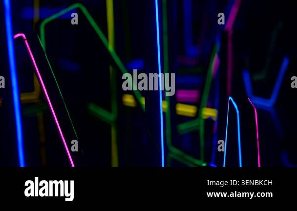 Glowing Neon Light Ribbons Flowing Through Dark Space. Colorful Neon ...