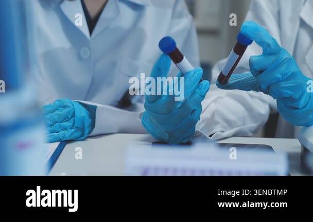 scientist in protective gloves holding a sample with a tube Stock Video ...