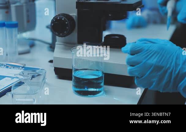 scientist in laboratory making chemical experiment with tube Stock ...