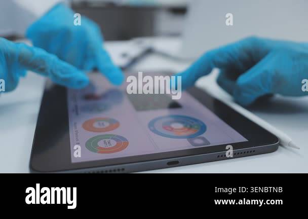 close up of doctor hand holding digital tablet and digital tablet in ...