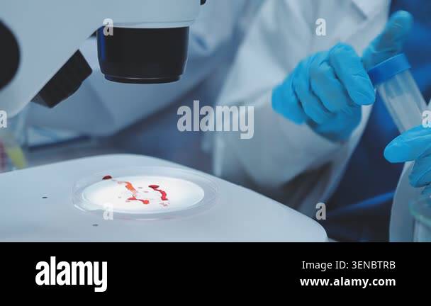 scientist in protective gloves and gloves holding tube with blood ...