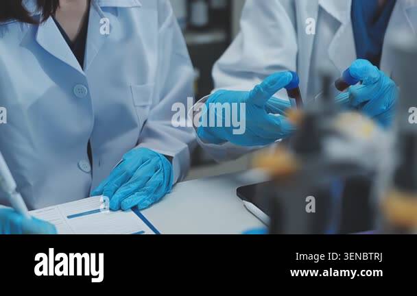 scientists working with chemical tubes Stock Video Footage - Alamy