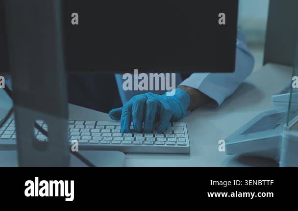 scientist working in laboratory, using laptop computer. technology ...