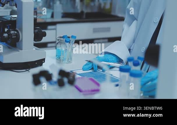 laboratory assistant with a microscope Stock Video Footage - Alamy