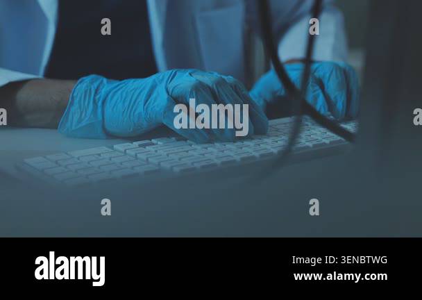 close up of a doctor using a computer keyboard Stock Video Footage - Alamy