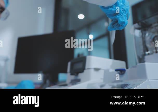 laboratory scientist holding test tube with blood sample in laboratory ...