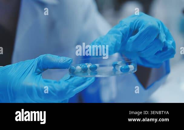 scientist holding blue liquid in hand Stock Video Footage - Alamy