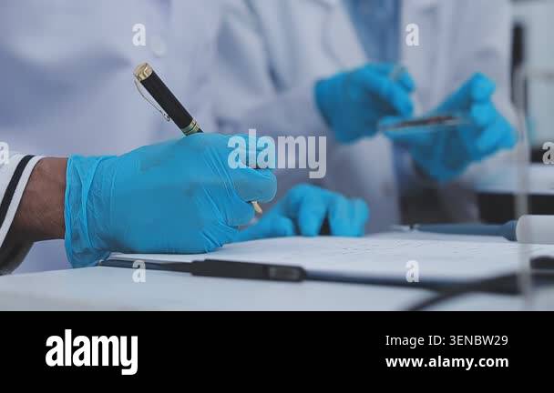 close up of doctor hand holding a syringe Stock Video Footage - Alamy