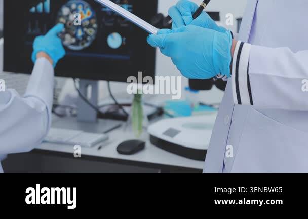 scientist holding test tube and writing in a chemical laboratory Stock ...