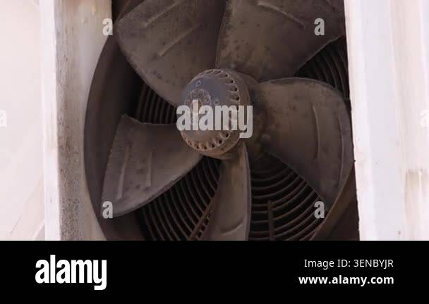 Dirty and dusty industrial fan of an outdoor air conditioning unit ...