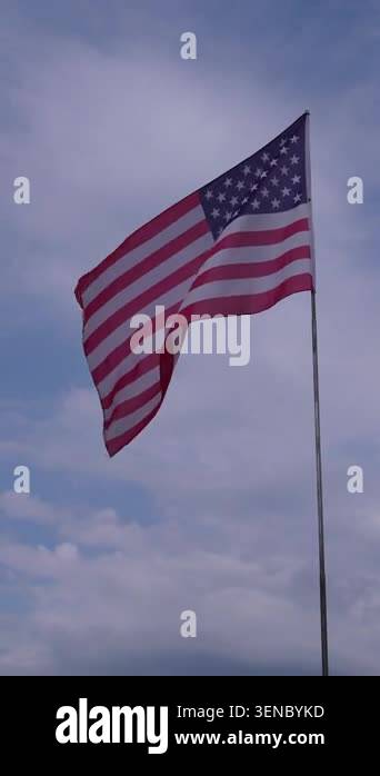 National flag of the united states of america flying on a flagpole ...
