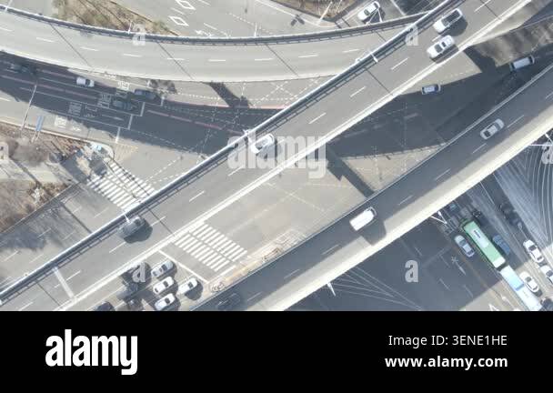 Cars drive along traffic intersection in city, aerial view Stock Video ...