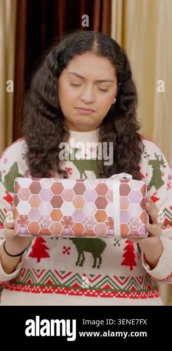 Vertical Video of Indian Woman Shaking Gift Box to Guess Whats Inside ...