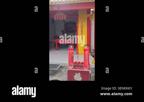 Traditional Chinese temple featuring vibrant red decorations ...