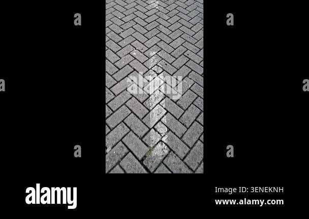 A vertical tracking shot looking down at a clean textured pattern of ...