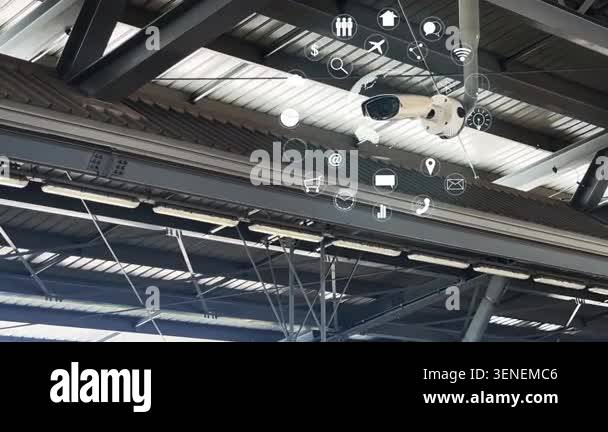 Smart CCTV surveillance camera monitoring an industrial facility with ...