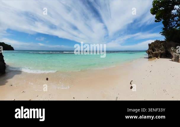 Beautiful ocean waves on sandy shoreline in Carabao Island in Romblon ...