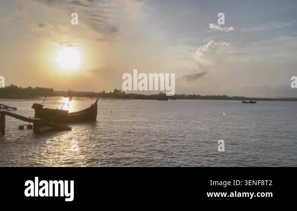 Traditional Wooden Fishing Boat Moored at Bridge During Golden Hour ...