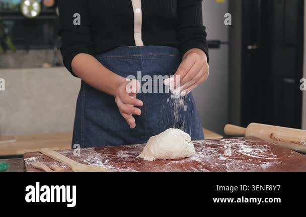 Professional chef making homemade Italian pizza Sprinkle flour over the ...