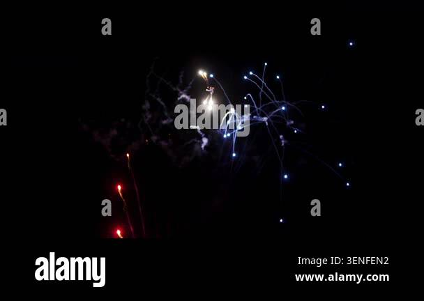 Blue and white glowing points curve into delicate light trails against ...