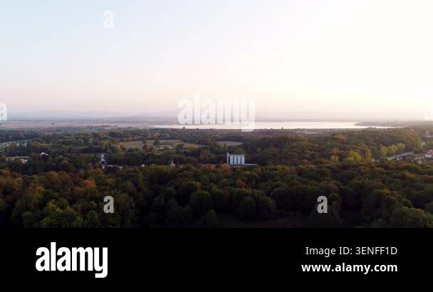 Elevated view of a wooded landscape at sunrise with treetops filling ...