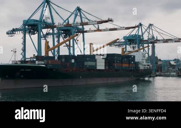 Cargo ship with containers in the sea port for the transport of goods ...