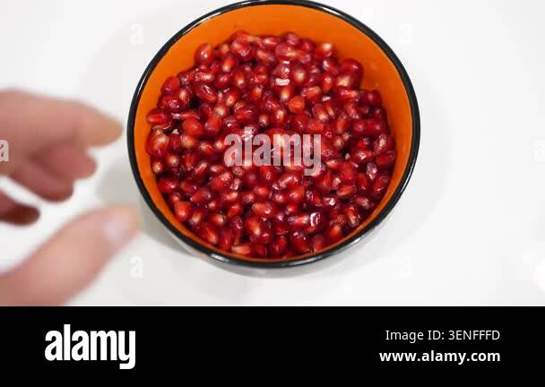 Fresh peeled pomegranate fruit, ripe pomegranate in a plate, red ...