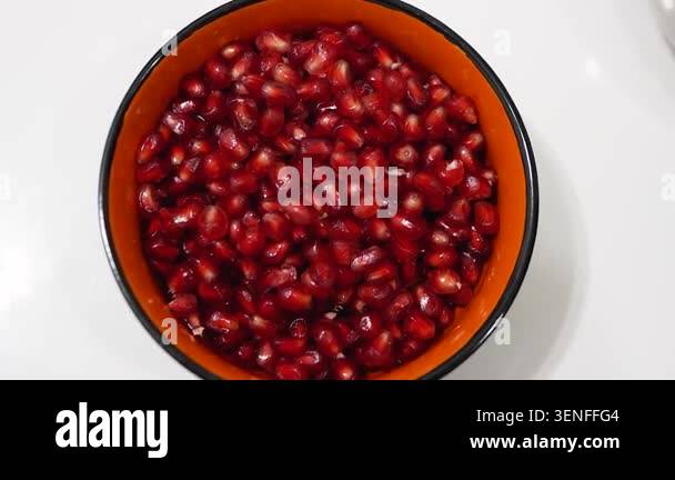 Top view, Peeled pomegranate fruit, ripe pomegranate in a plate, red ...