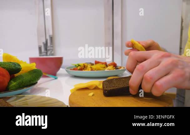 Man's dinner, bread and cheese in a plate at dinner, slow motion Stock ...