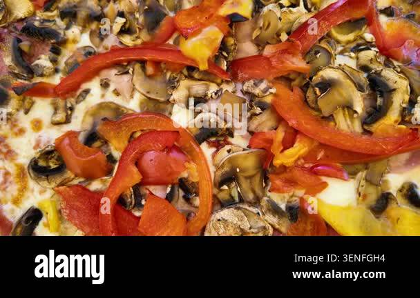 Detailed view of gourmet pizza toppings with melting cheese and juicy ...