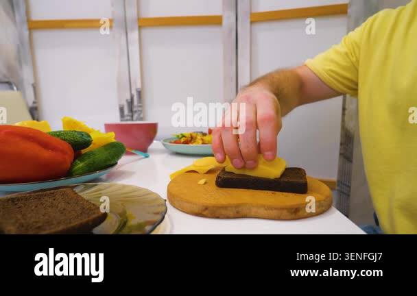 Man's dinner, bread and cheese in a plate at dinner, slow motion Stock ...