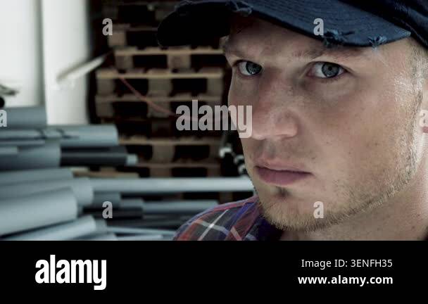 Portrait of a man in a black cap, sad guy with a shrewd look. Upset ...