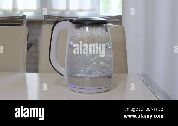 Water boils in a transparent teapot, water boils in a teapot Stock ...