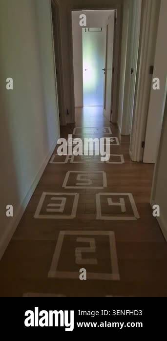 Hopscotch game marked in a home hallway, creating a playful indoor ...