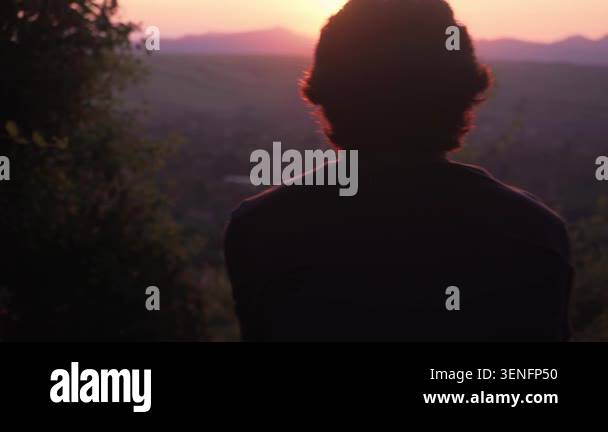Man in Silhouette Contemplating Nature at Golden Hour Sunset Stock ...