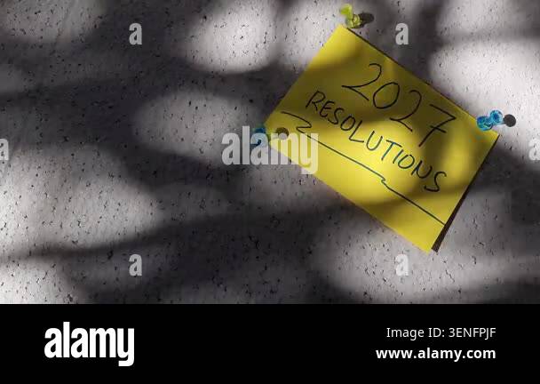 2027 Resolutions Handwritten On Yellow Sticky Note Pinned Under Swaying ...