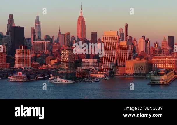 Aerial panning view of Manhattan skyscrapers and Chelsea waterfront at ...