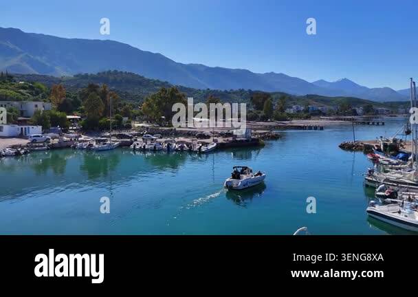 Aerial view of a speedboat entering a marina Stock Video Footage - Alamy