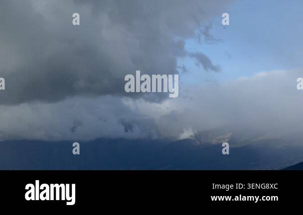 Dark storm clouds moving over mountains intense weather landscape video ...