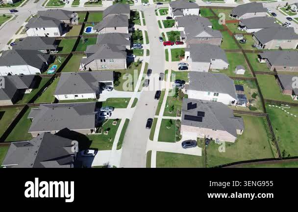 Curved lane home cluster in Arlington, Texas displays fenced yards ...
